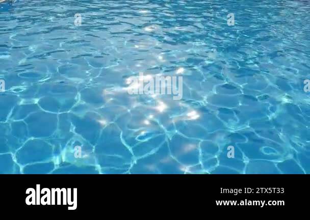 Wonderful wading pool water shining with its moving blue waves in slo ...