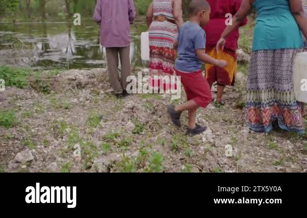 Villagers filling water containers water Stock Videos & Footage - HD ...