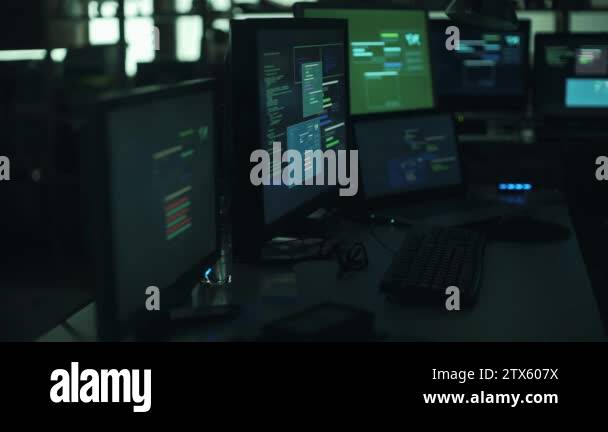 Developer and hacker hidden workstation, multiple screens and connected computers: cyber ...