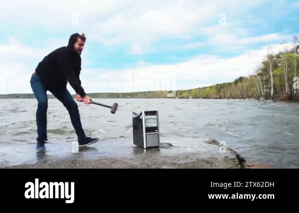 Concept of freedom from computer addiction - Man breaks system unit of ...