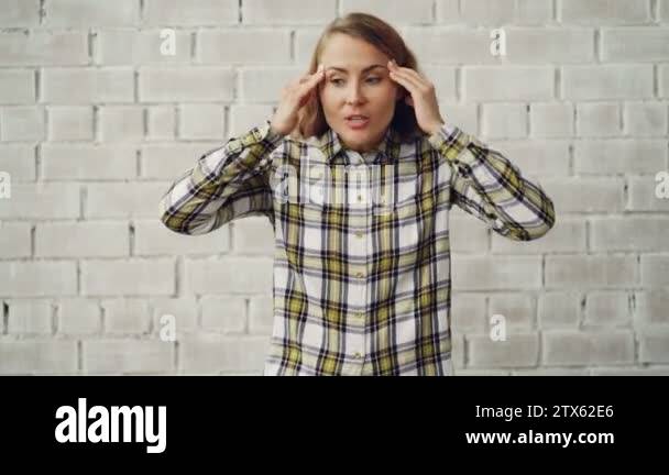 Portrait of angry young woman yelling and gesturing expressing negative ...