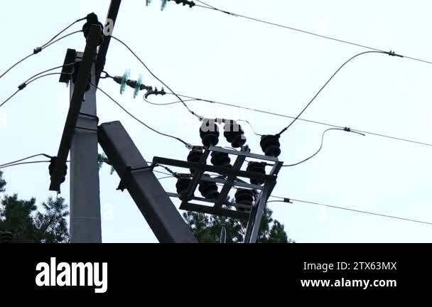 power poles. transformer and circuit breaker. electrical wires and ...