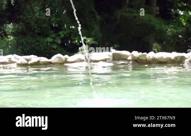 Slow motion splasing water jet in a hot springs in the Caribbean. Slow ...