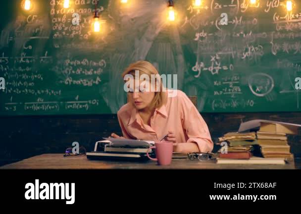 The teacher prints the text on the typewriter. Learning concept. School ...