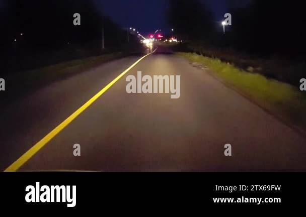 Driving Long Road at Night With Oncoming Vehicle Flashing High Beams ...