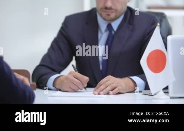 Japanese diplomat signing document of national importance, business ...
