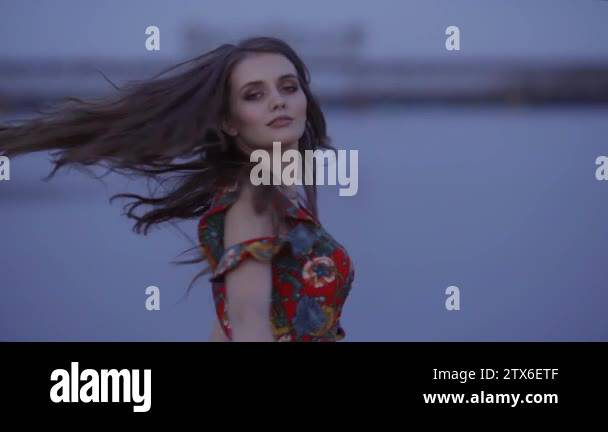 Positive wonderful girl with red hair is posing at the camera. 4k ...