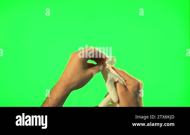 Man Take Off And Puts On His Surgical Gloves Green Screen Stock Video