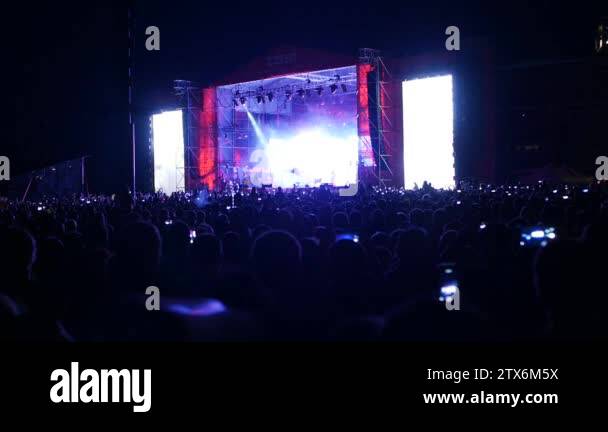 BOBRUISK, BELARUS - JULY 6, 2018: a crowd of people watch on stage ...