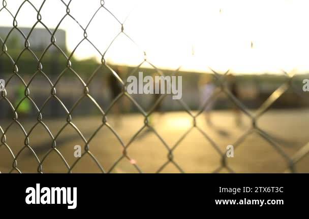 Children are playing football in the sunshine day in a village. Slow ...
