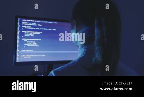 Experienced IT woman programmer works on a new program. Young woman ...