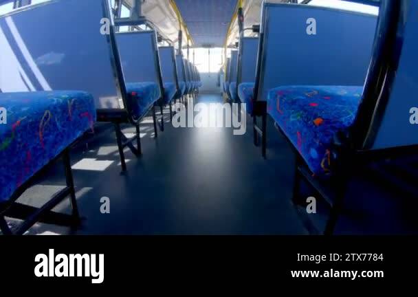 Rows of empty seats in a bus Stock Video Footage - Alamy