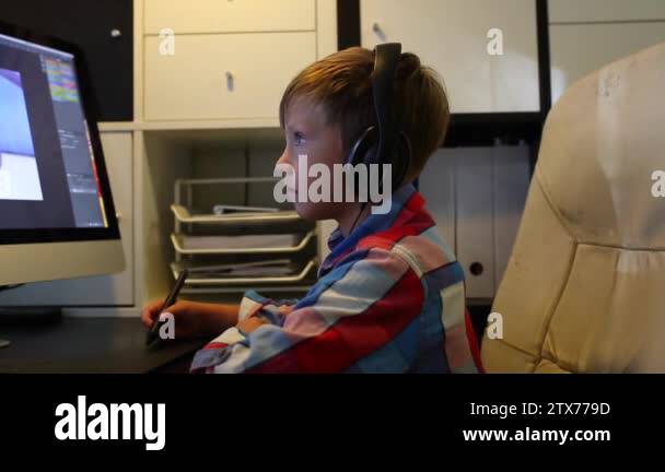 Smart Boy Works on a Project For His Computer. Boy works at the ...