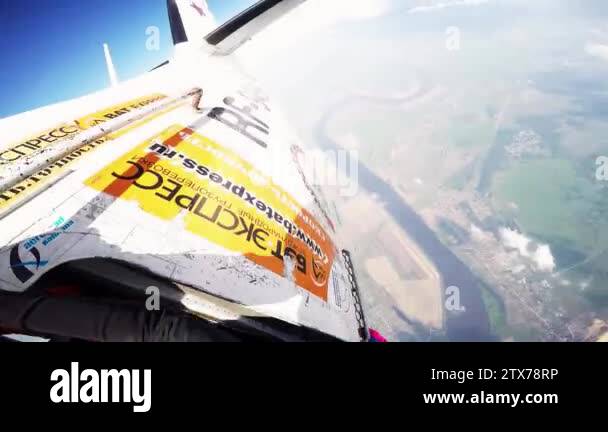 MOSCOW, RUSSIA - JUNE 10, 2015: Skydivers jump from airplane, make ...