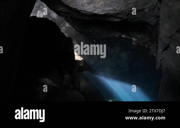 Steaming waters of Grjotagja Cave in Iceland. Grjotagja volcanic cave ...
