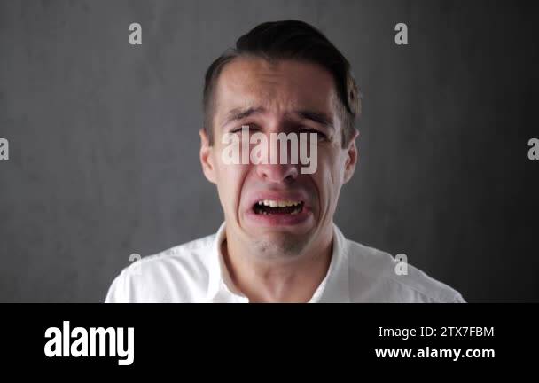 Portrait of sad man crying with tears in eyes. Depressed businessman ...