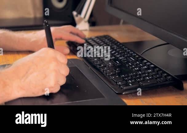 Close up view on graphic designers hands using tablet and touch screen ...