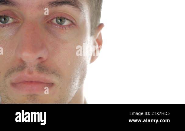 Half face portrait of sad man crying with tears in eye at isolated ...