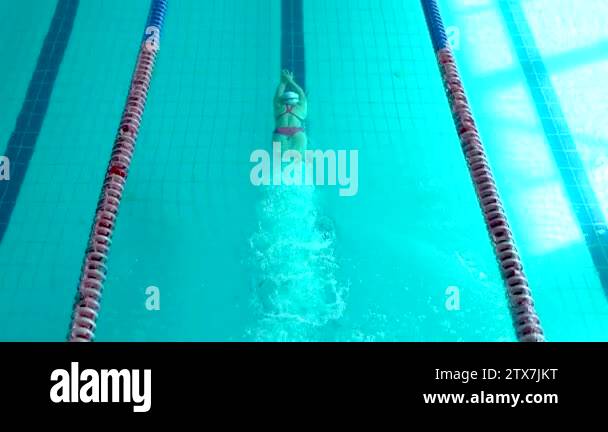 Girl Swimmer Dive In Swimming Pool. Female swimmer dives in swimming ...