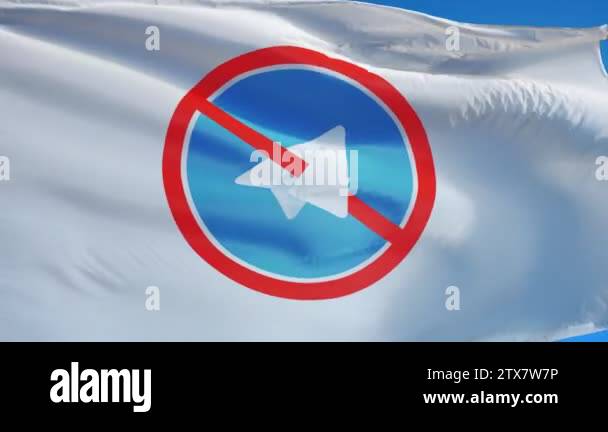 Telegram ban company flag waving in slow motion against blue sky ...