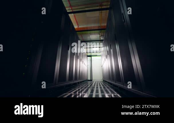 Datacenter server room concept. Dark room with server units and a ...
