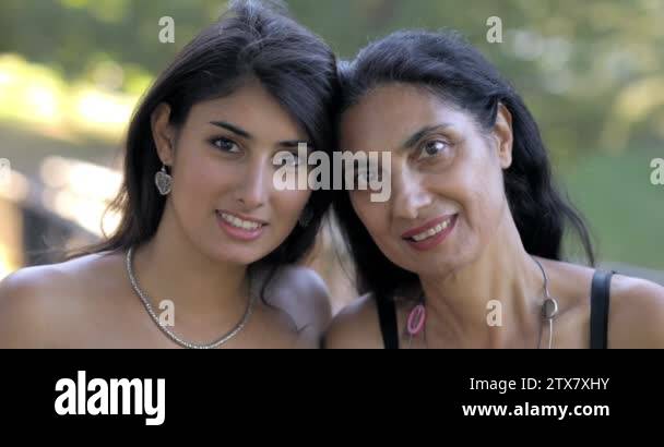 family portrait, generations in comparison. Mother and daughter smiling ...