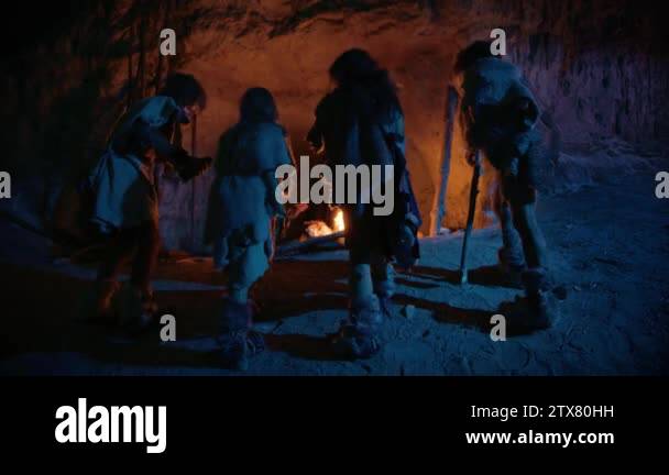 Tribe of Prehistoric Hunter-Gatherers Wearing Animal Skins Live in a ...