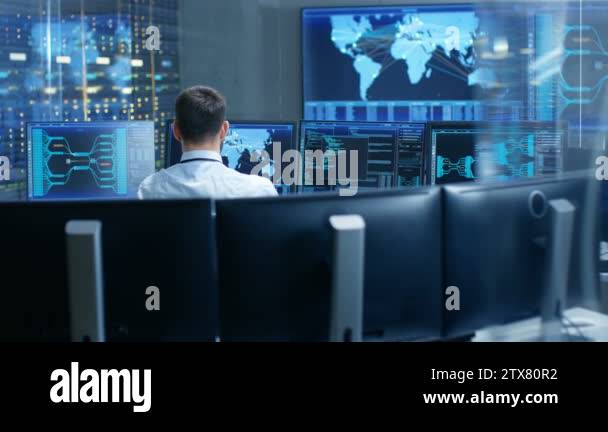 Back View in the System Control Center Operator Working. Multiple ...