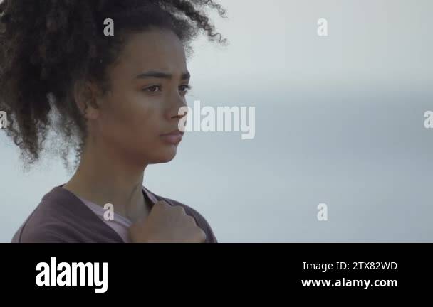 Depressed African-American teen girl standing alone, awkward age ...