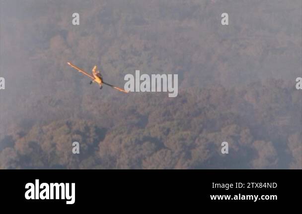 Fire fighting plane spraying fire extinguisher on burning forest, Mount ...