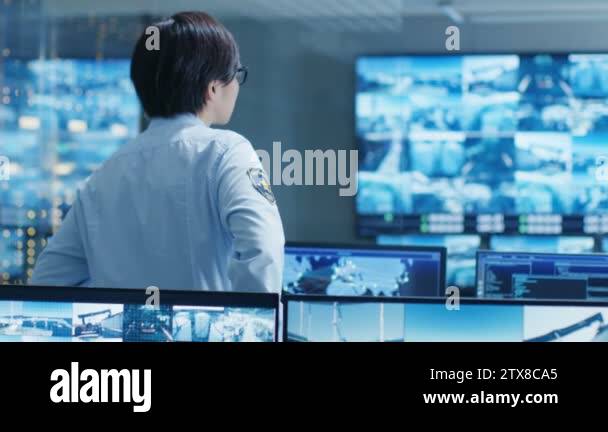 In the Security Control Room Officer Monitors Screens for any ...