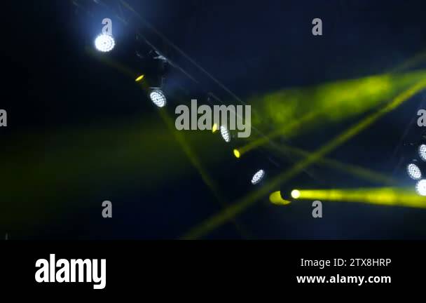Blue and yellow light on the stage. Soffits shine at a concert ...