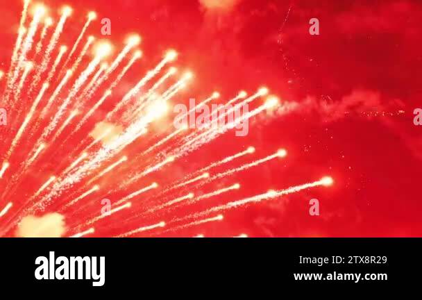 Bright firework explosion in the night sky. Fireworks salute with the ...