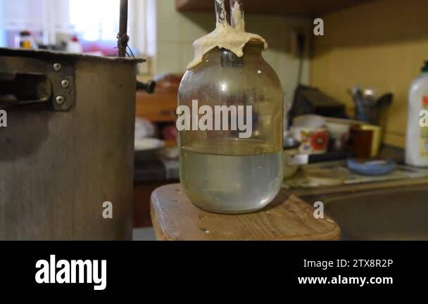 Preparation a moonshine at home, distillation process. Dry steam is ...