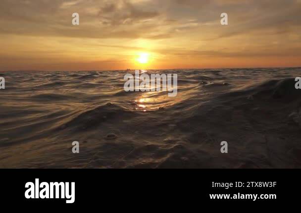 SLOW MOTION, CLOSE UP: Small sailing boat with lovers swinging on ...