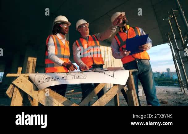 Engineers layouts talking in building Stock Videos & Footage - HD and 4K Video Clips - Alamy