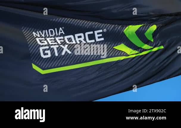 Nvidia GeForce GTX logo flag waving in slow motion against blue sky ...