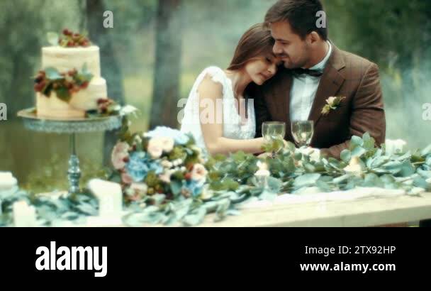 Romantic dinner in misty forest. Attractive sensitive loving couple in ...