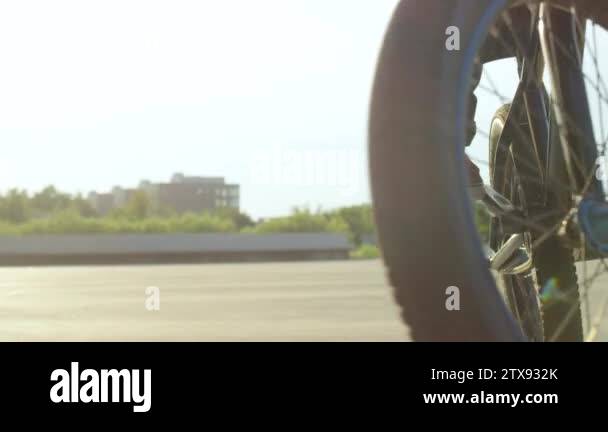 SLOW MOTION CLOSE UP: Extreme bmx biker riding bike and jumping 360 ...