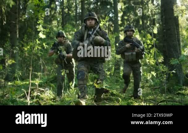 Three Fully Equipped Soldiers Wearing Camouflage Uniform Attacking ...