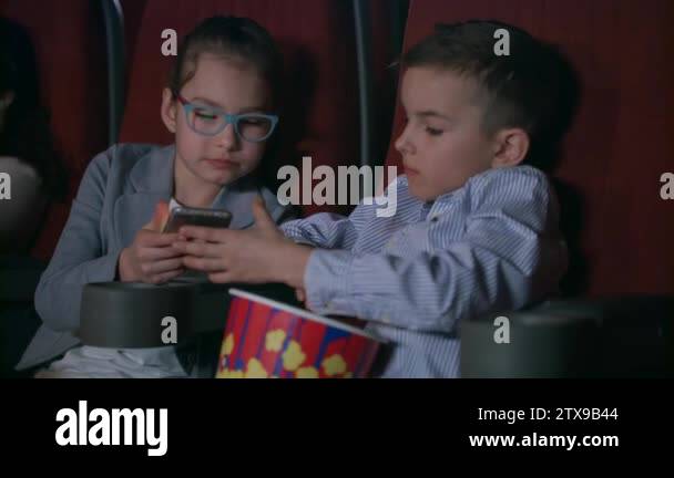 Kids cinema popcorn Stock Videos & Footage - HD and 4K Video Clips - Alamy
