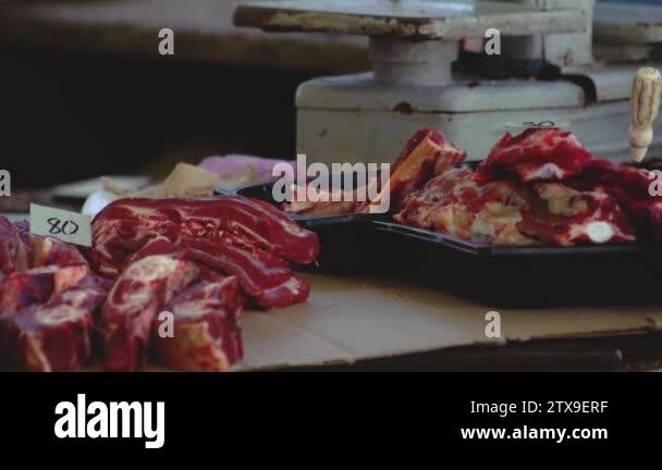 Meat in a street market, close up view, walk around, unsanitary ...