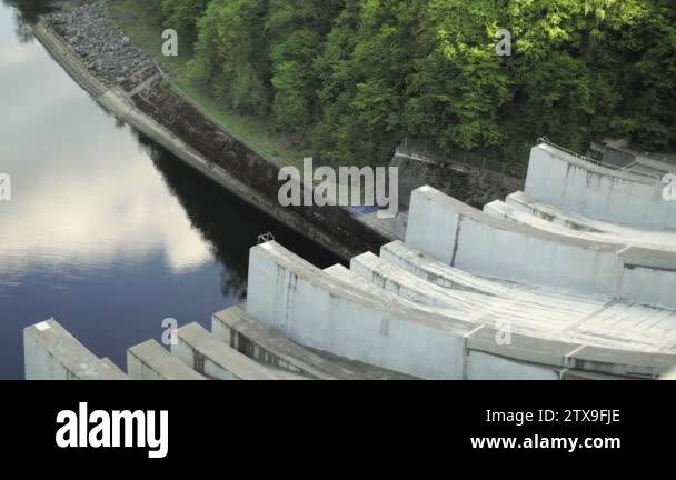 Water giant concrete dam, hydroelectric powerstation. View from the dam ...