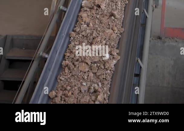 Machines working and conveyor line transporting sand. Conveyor belt on ...