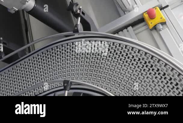 Curved Conveyor Belt at Production Line With Emergency Stop Button ...