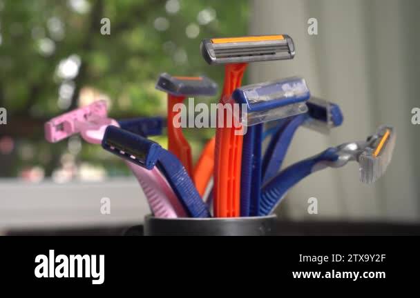 Bunch of old disposable razors. The problem of plastic pollution of the ...