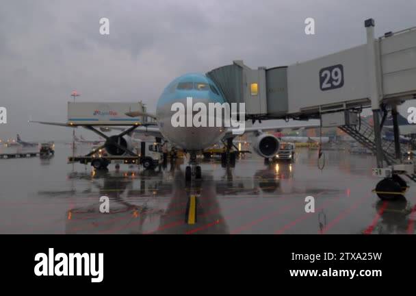 Deboarding and unloading cargo of Korean Air aircraft Stock Video ...