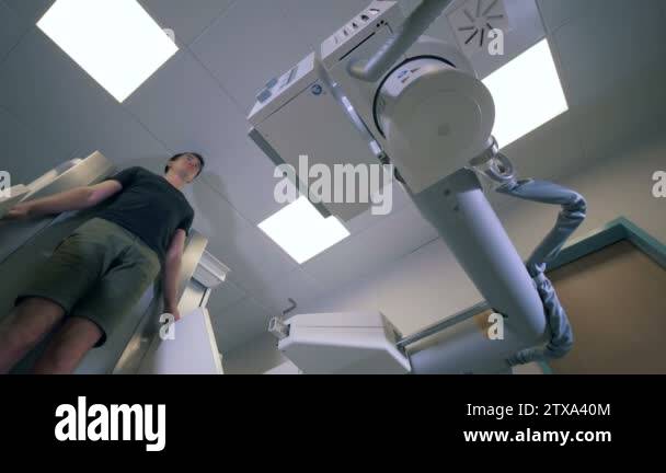 Process of medical x-ray scanning on a patient, bottom view Stock Video ...