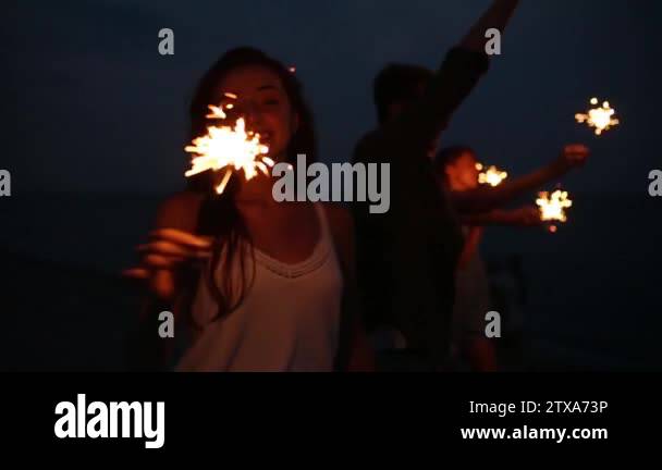 Friends walking, dancing and having fun during night party at the ...