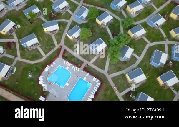 There are two swimming pools in the summer village and many houses ...
